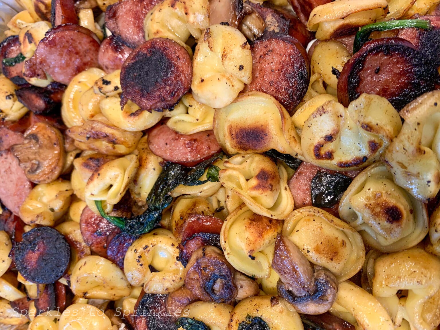 Blackstone Grilled Kielbasa, Tortellini, & Spinach Casserole - Sparkles to Sprinkles
